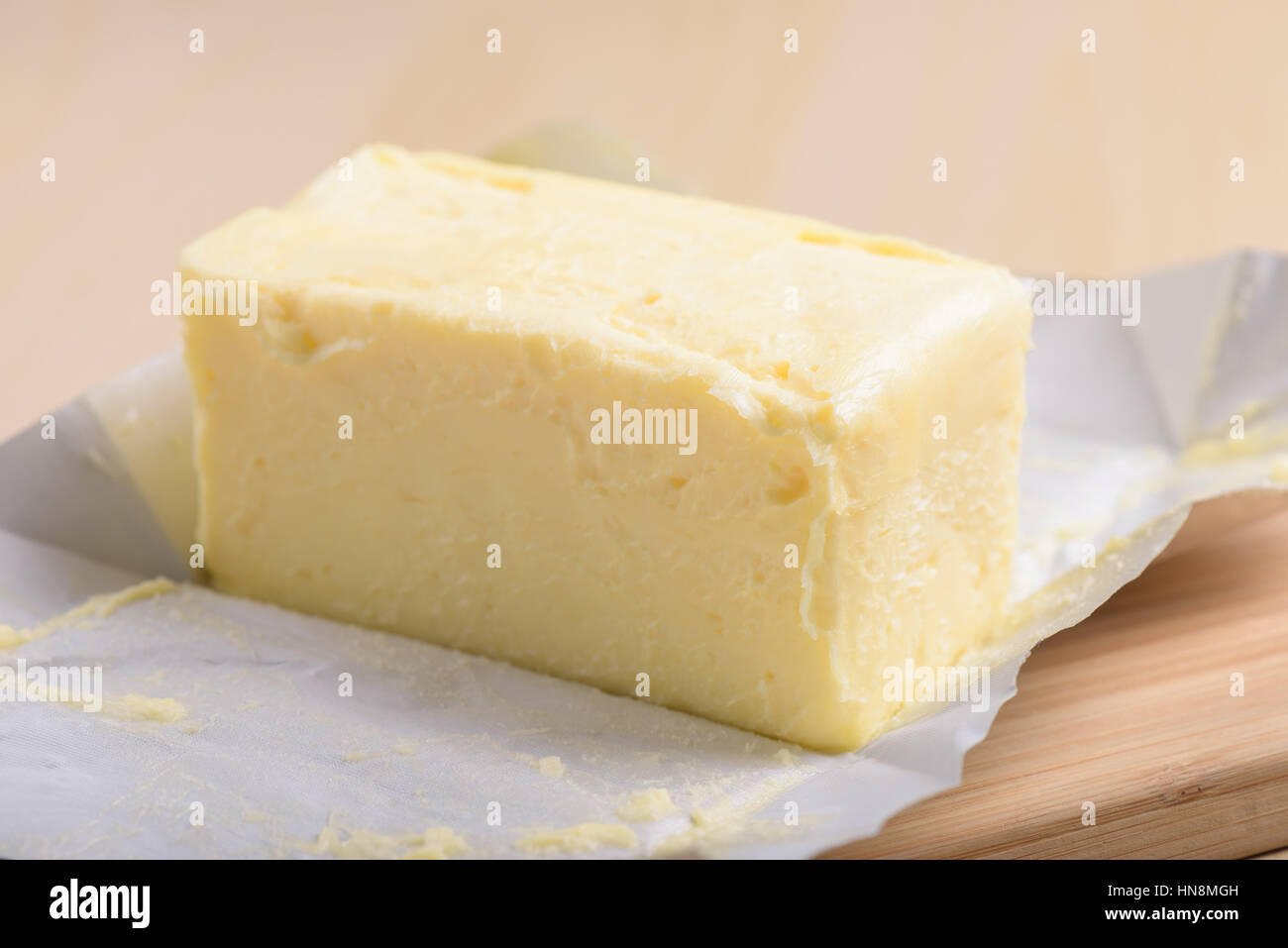 closeup creamy butter in its unwrapped foil paper Stock Photo - Alamy
