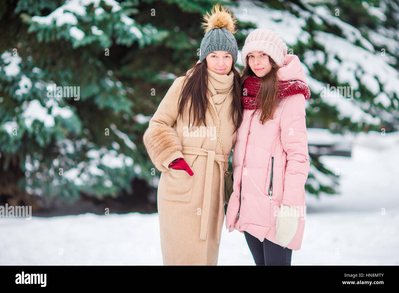 Young girlfriends outdoors on beautiful winter snow day Stock Photo - Alamy
