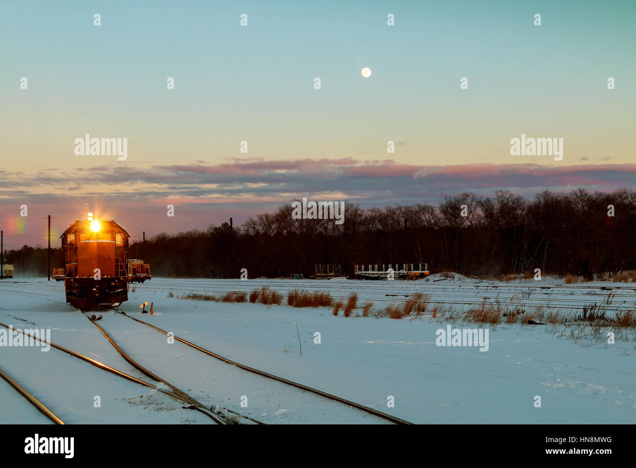 freight train travels through the vast expanses of snow-covered Stock ...