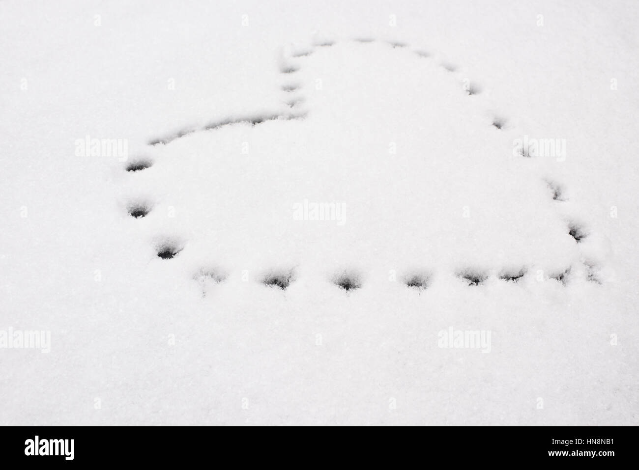 Heart on snow hi-res stock photography and images - Alamy