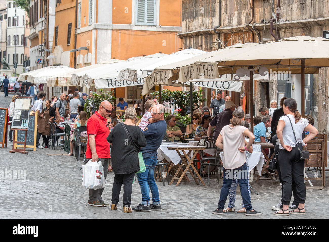 Rome, Italy- Locals and tourists eating outdoors at a pizzeria in a ...