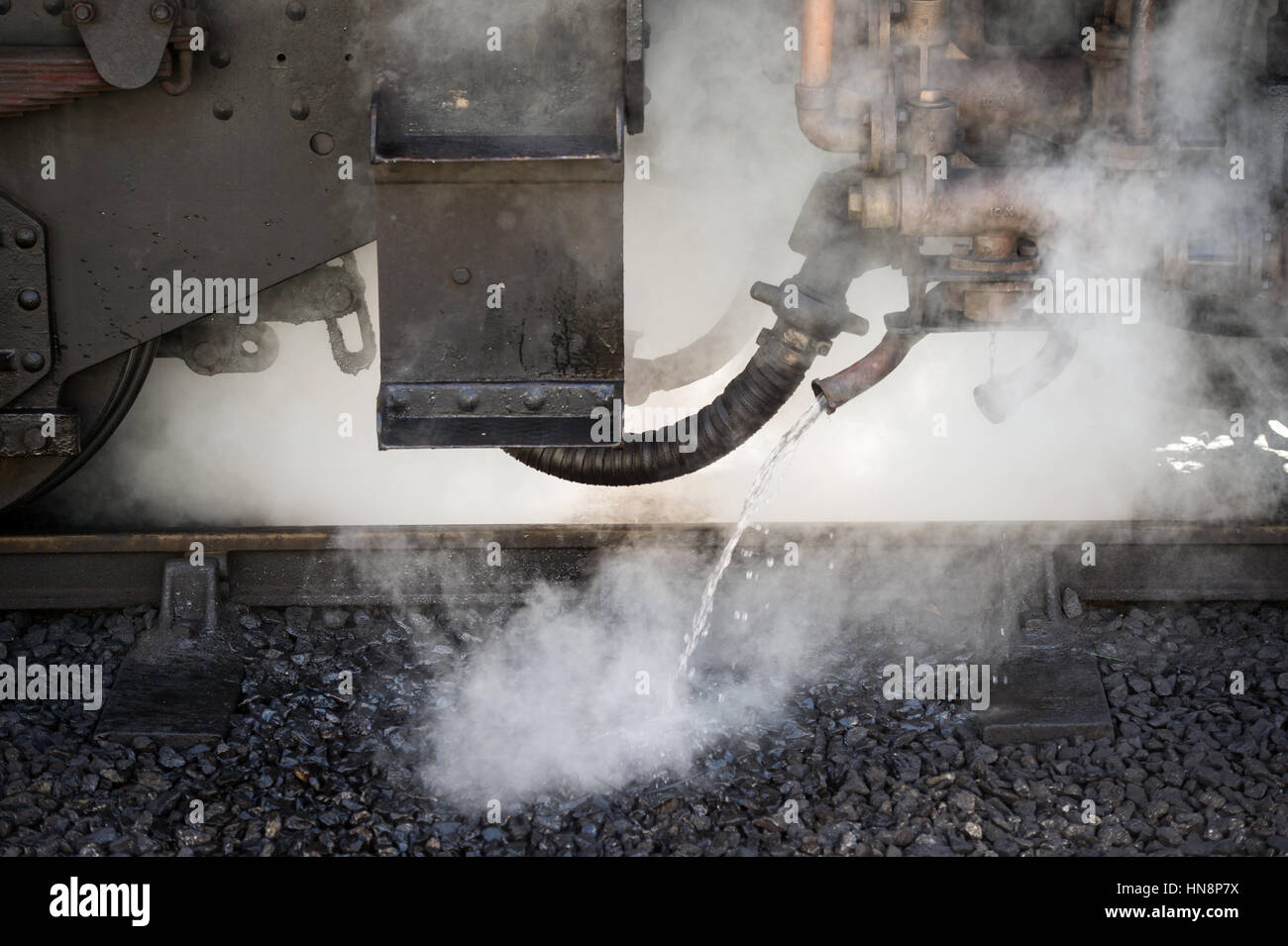 Steam coming up from underneath a train at Goathland railway station in ...