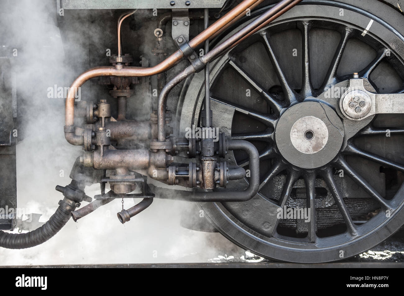 Steam coming up from underneath a train at Goathland railway station in ...