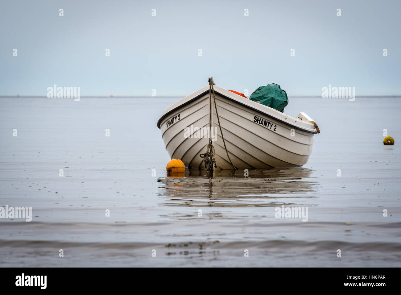 UK, England, Yorkshire - A boat in the water on a beach right outside ...
