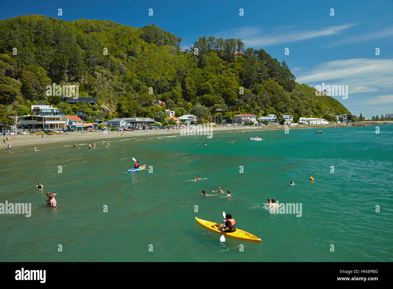 Kayaker and swimmers, Days Bay, Eastbourne, Wellington, North Island ...