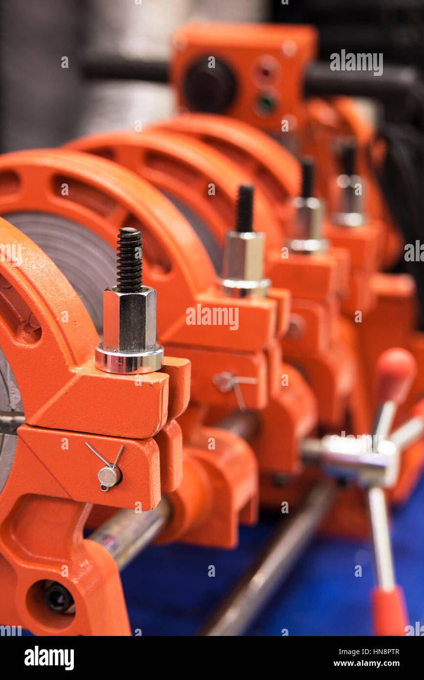 orange mechanic apparatus pipeline tubes Stock Photo - Alamy