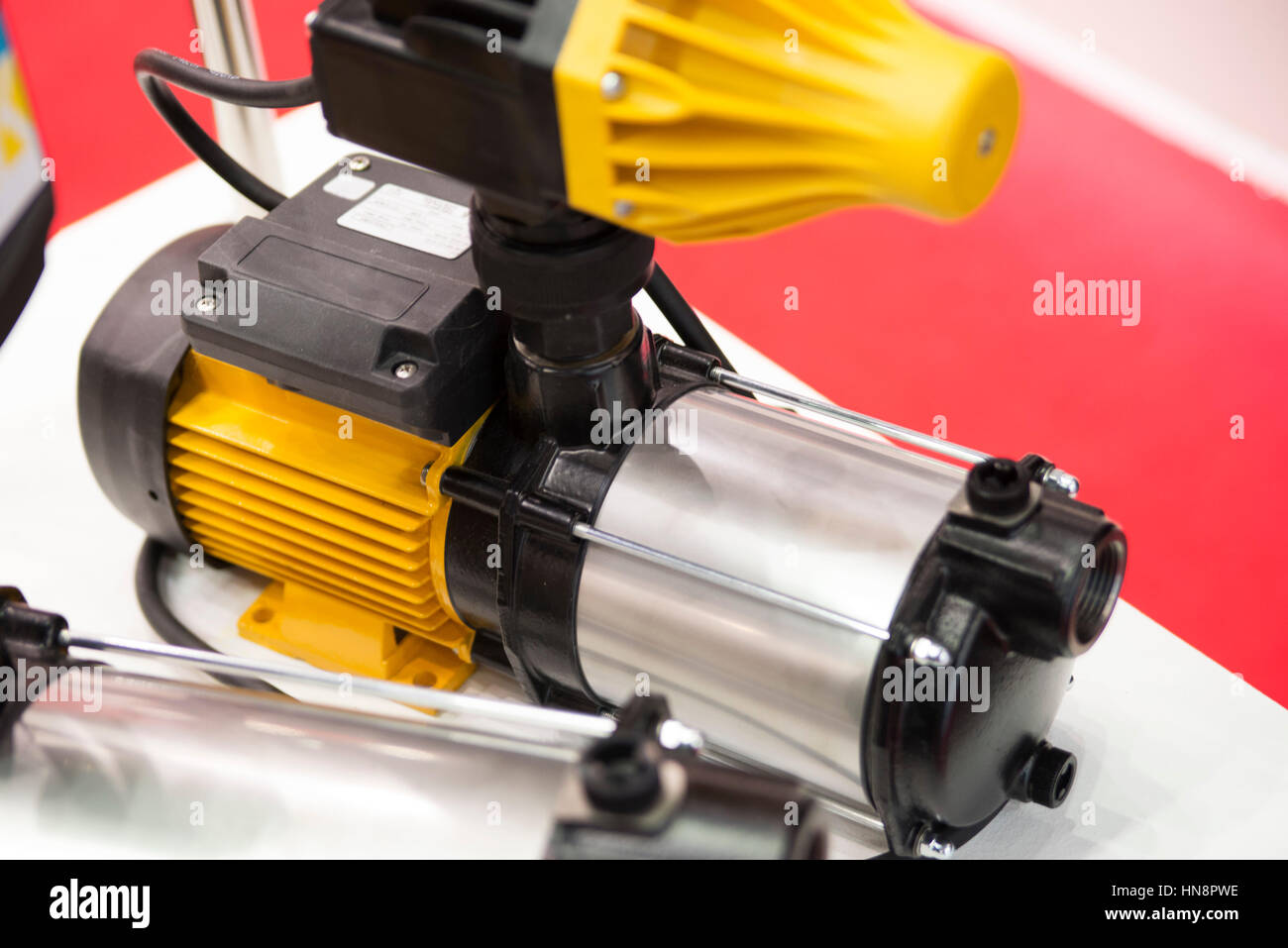 yellow steel metallic pump for pipeline tubes Stock Photo - Alamy