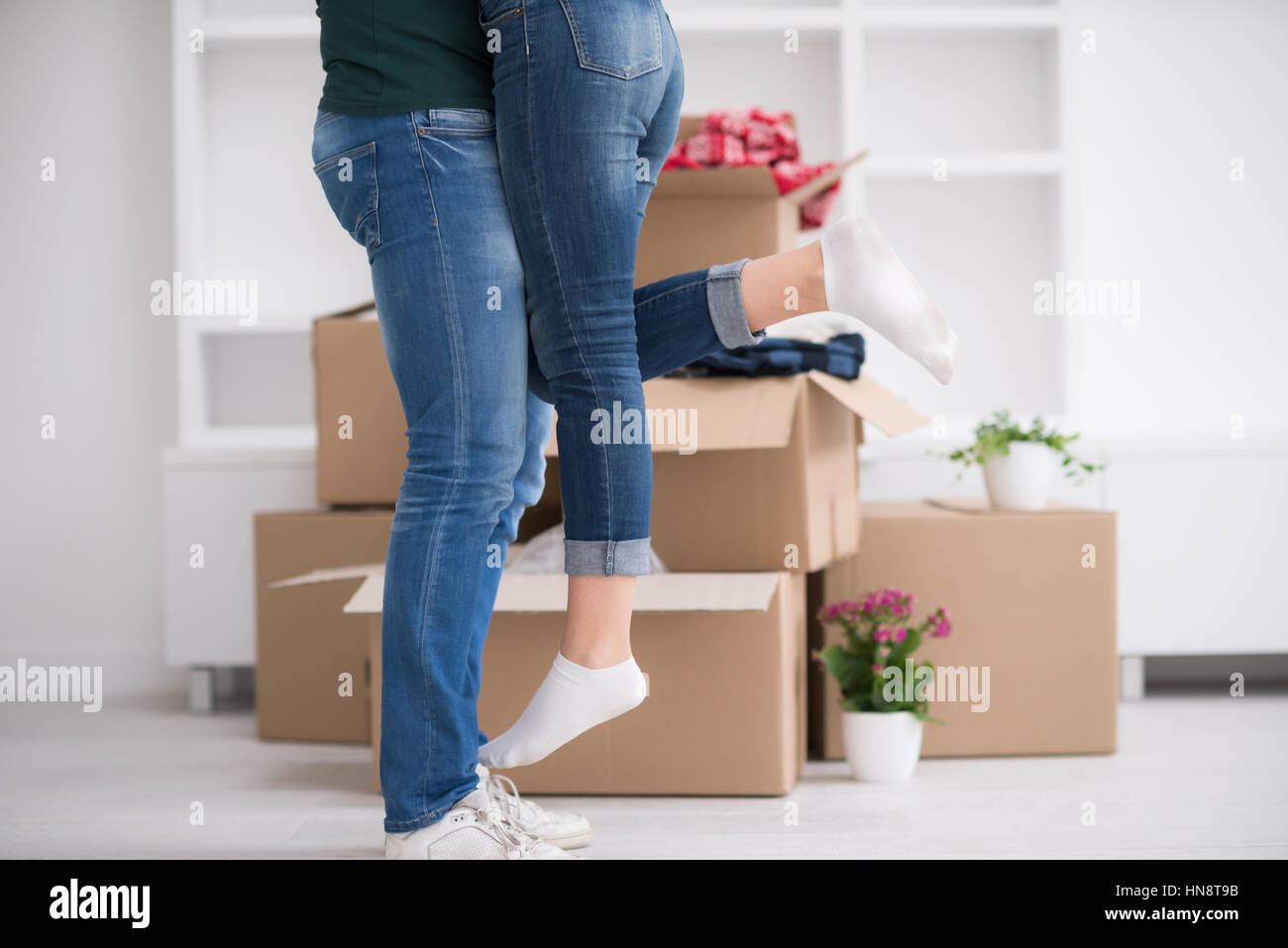 excited happy young couple looking forward to moving into a new home ...