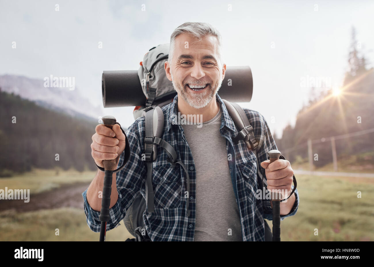 Man carrying rucksack hi-res stock photography and images - Alamy