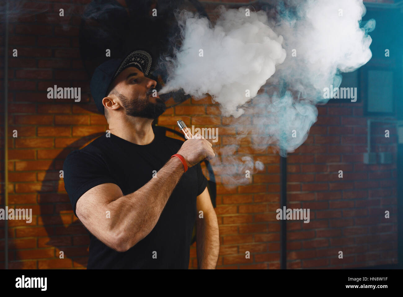 Man vaping an electronic cigarette Stock Photo - Alamy