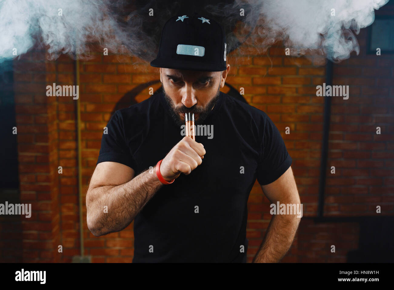 Man vaping an electronic cigarette Stock Photo - Alamy