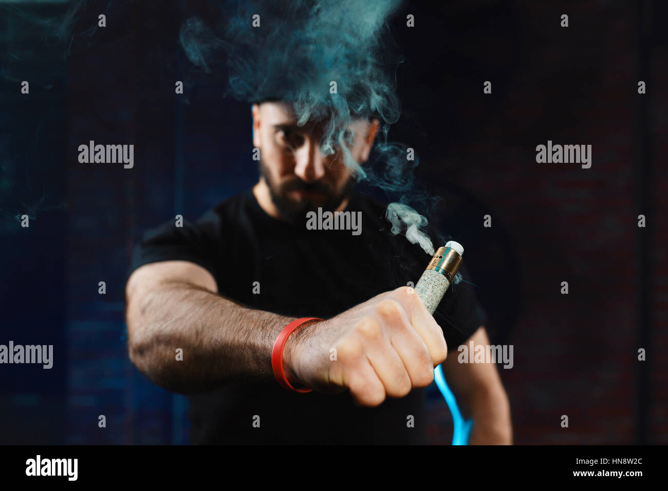 Man vaping an electronic cigarette Stock Photo - Alamy