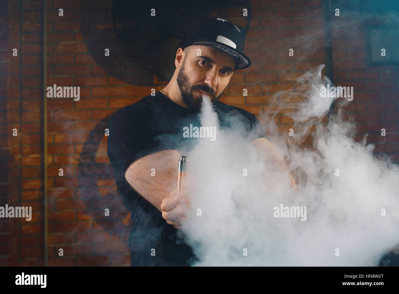 Man vaping an electronic cigarette Stock Photo - Alamy