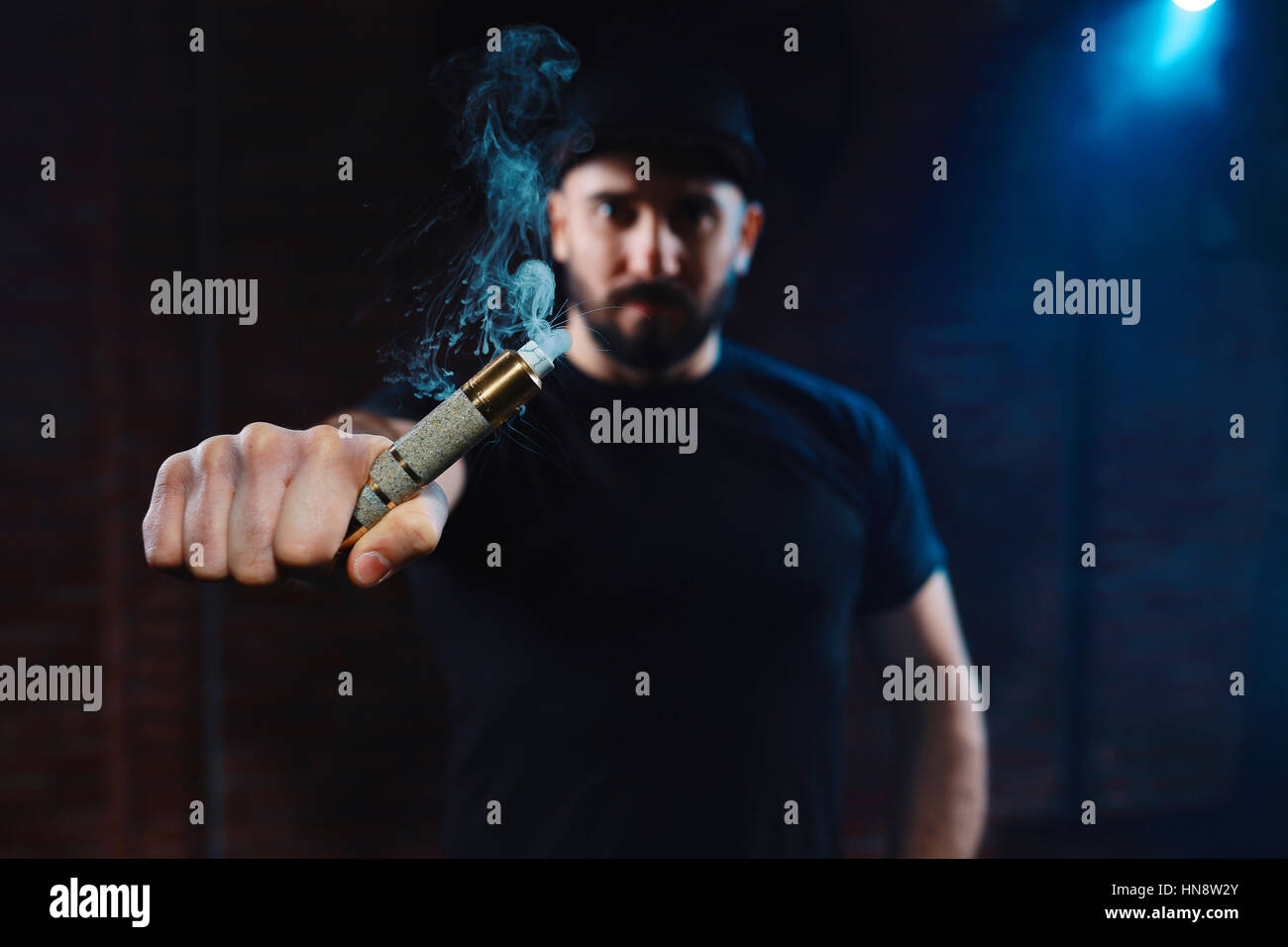 Man vaping an electronic cigarette Stock Photo - Alamy