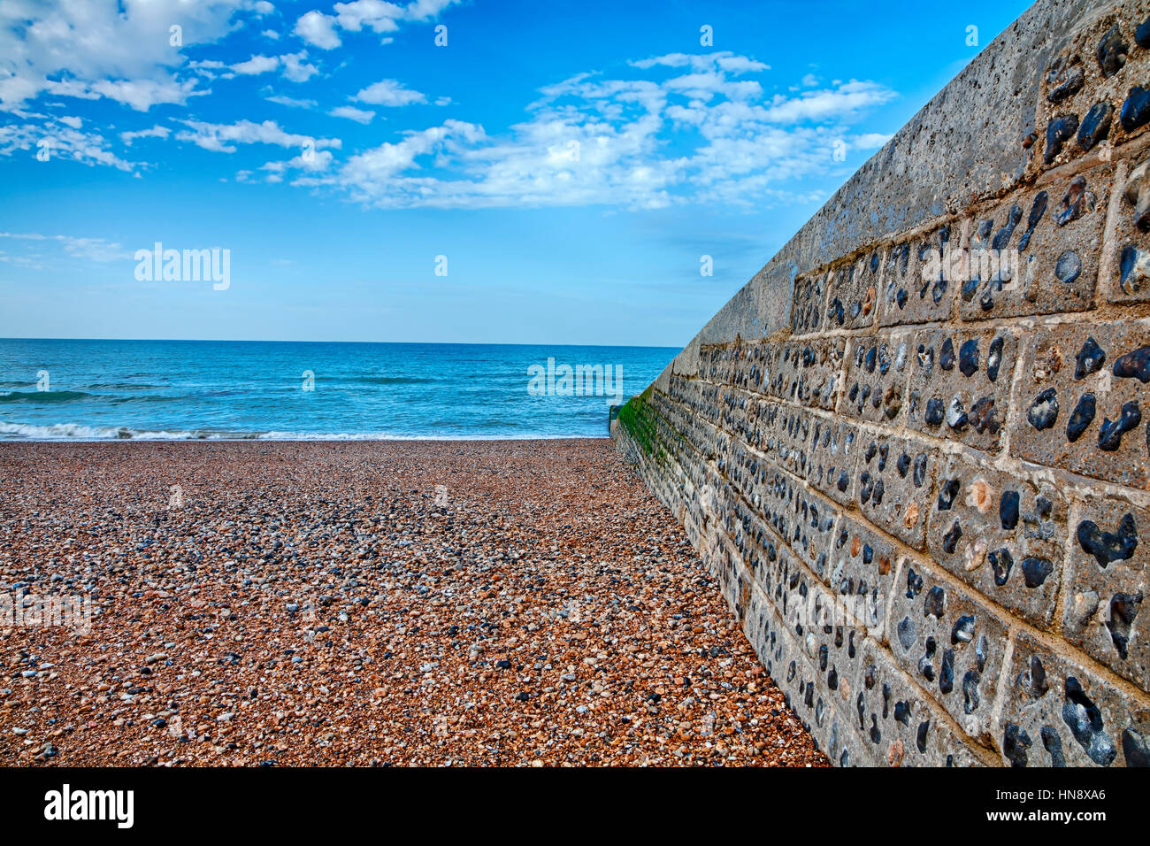 beach at brighton with sea wall and blue sky Stock Photo - Alamy
