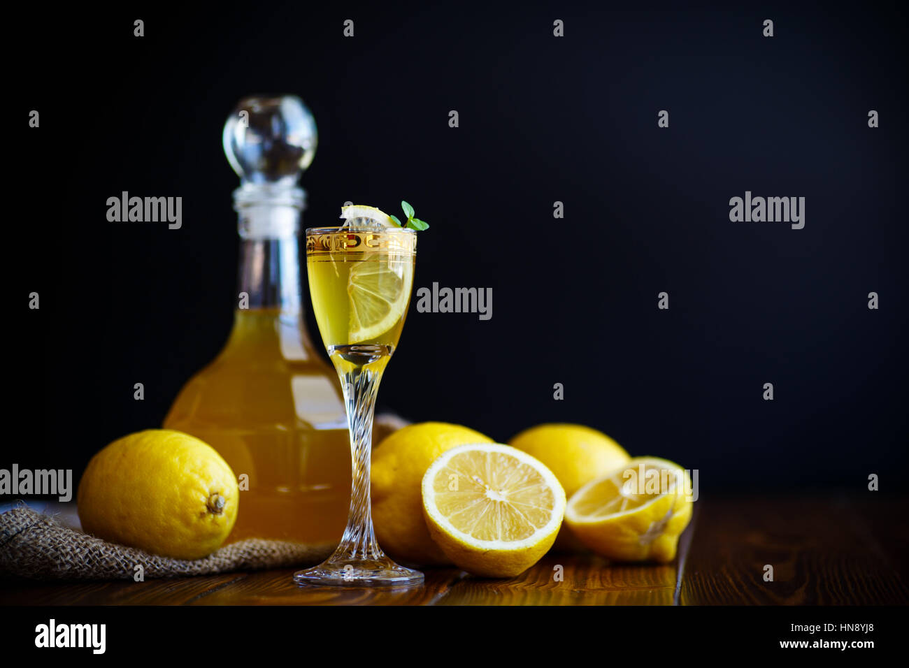 sweet lemon alcoholic brandy in the decanter on a dark table Stock ...