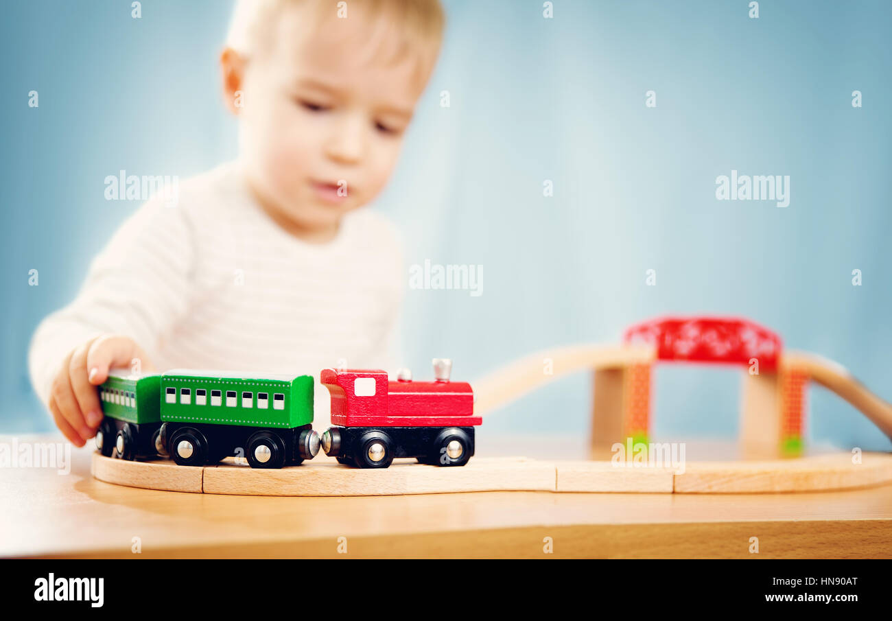 Portrait of a two years old child sitting at the table Stock Photo - Alamy