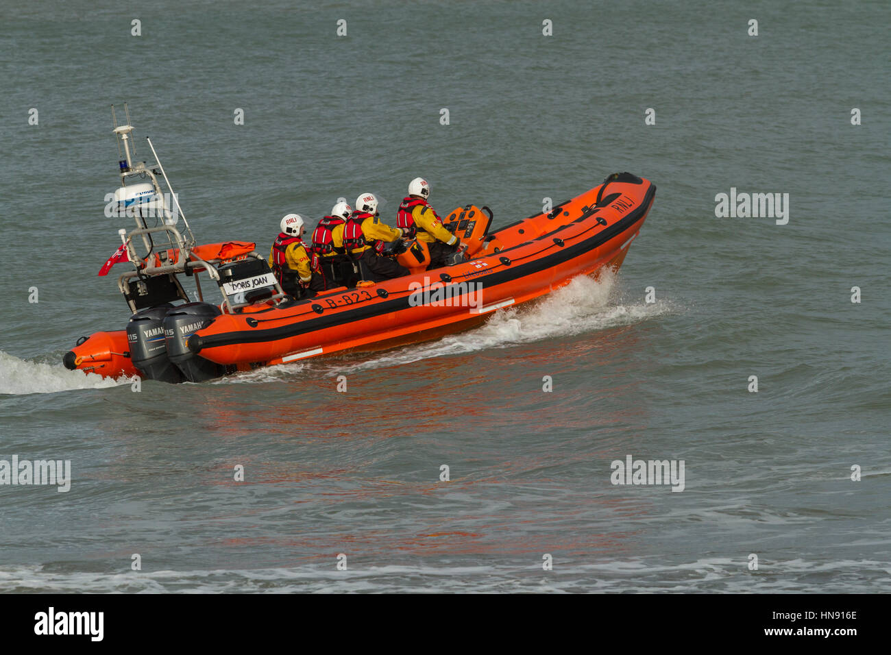 RNLI Lifeboat Inshore RIB launching off Criccieth Beach North Wales UK ...
