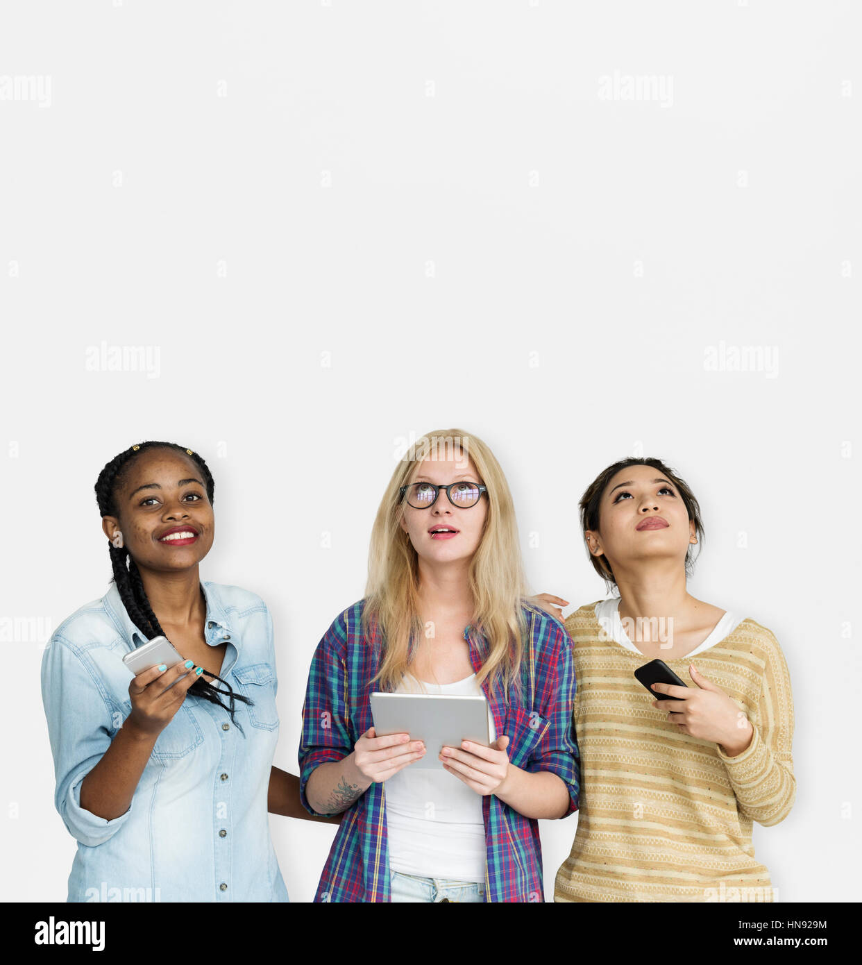 Group of Girls Using Technology Gadgets Stock Photo - Alamy