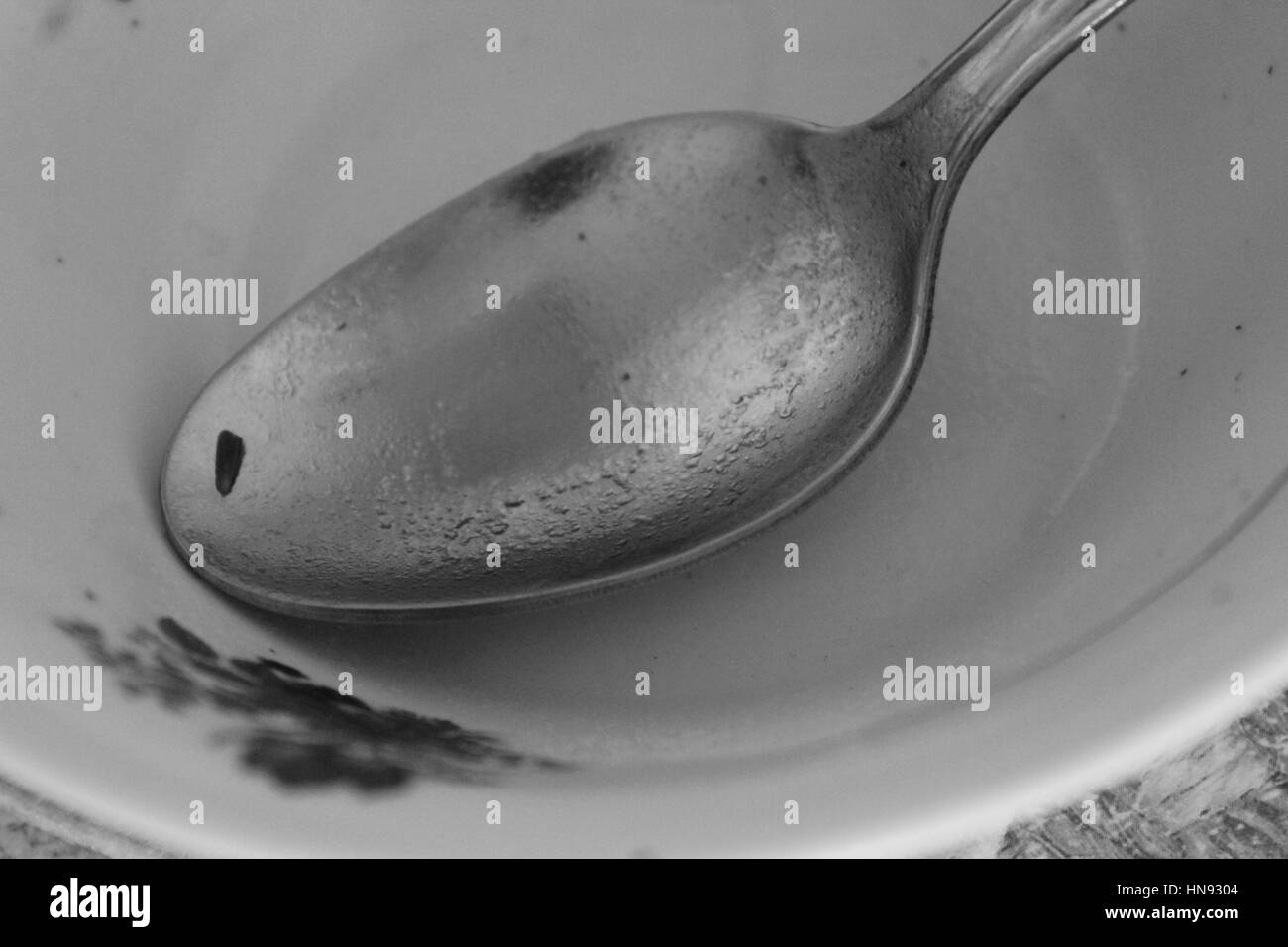 steel shine with little oil drops oval concave part of spoon lay in ...