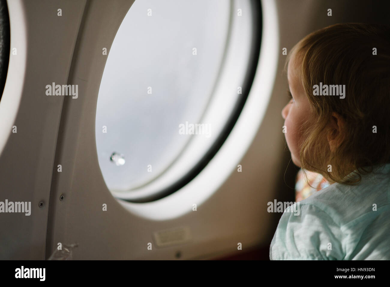 Child on an airplane Stock Photo - Alamy
