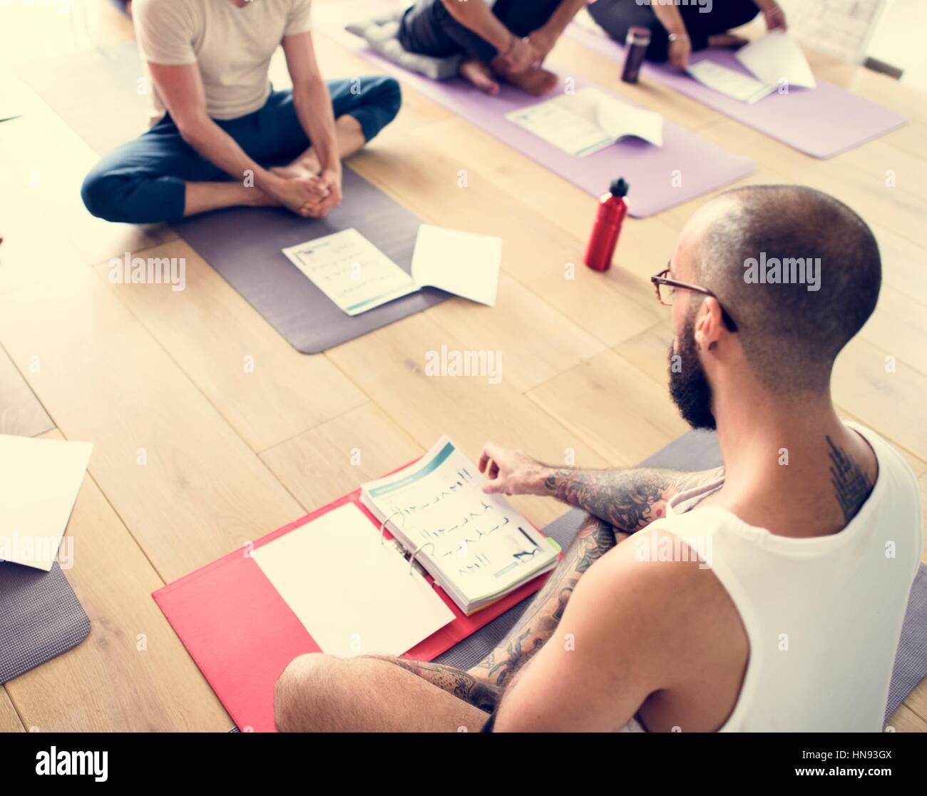 Happy diverse group practicing yoga hi-res stock photography and images ...