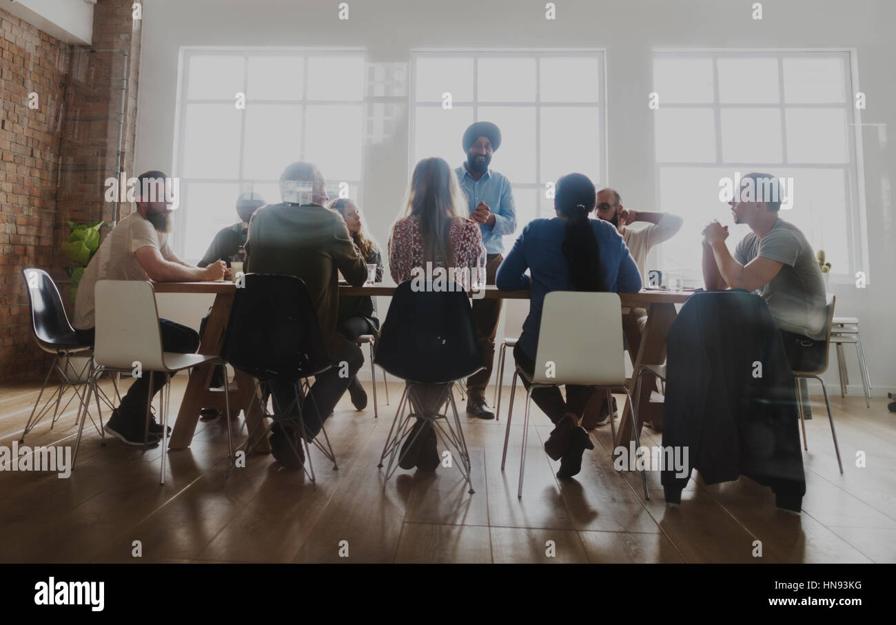 Diverse people teamwork on meeting table Stock Photo - Alamy