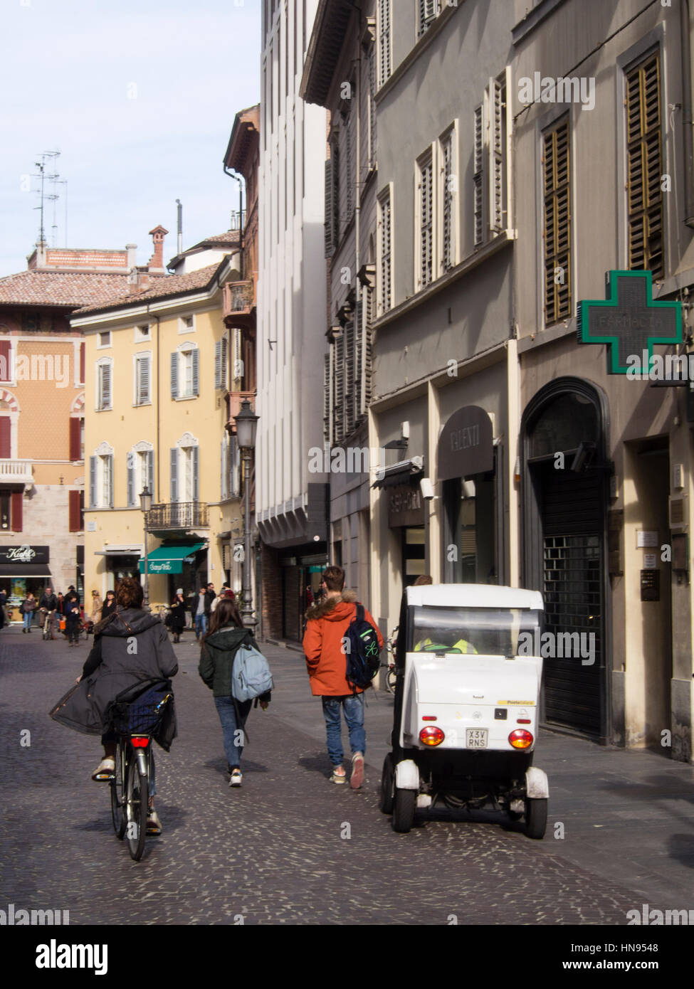 Post office electric car circulating in the limited traffic city center ...