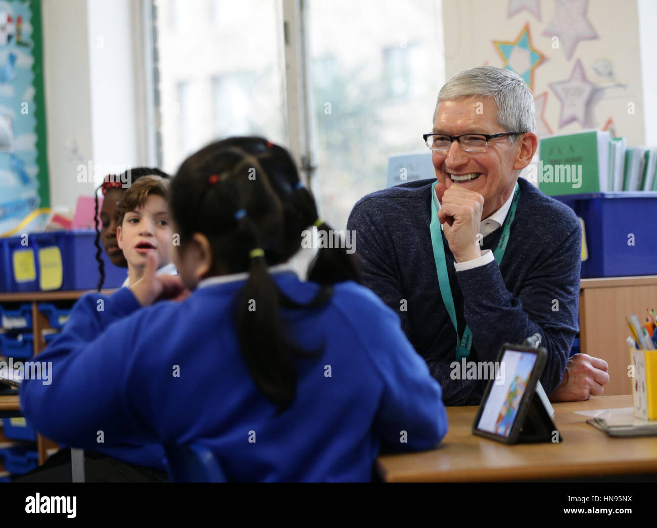 Tim Cook, CEO of Apple, interacts with Year 5 pupils in a classroom ...