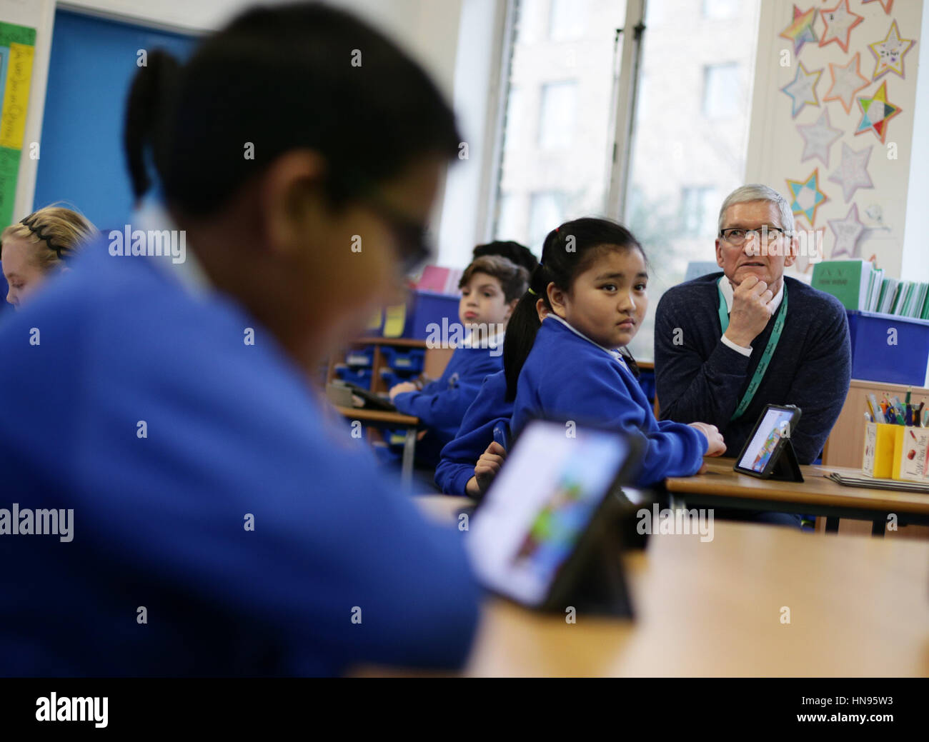 Tim Cook, CEO of Apple, interacts with Year 5 pupils in a classroom ...