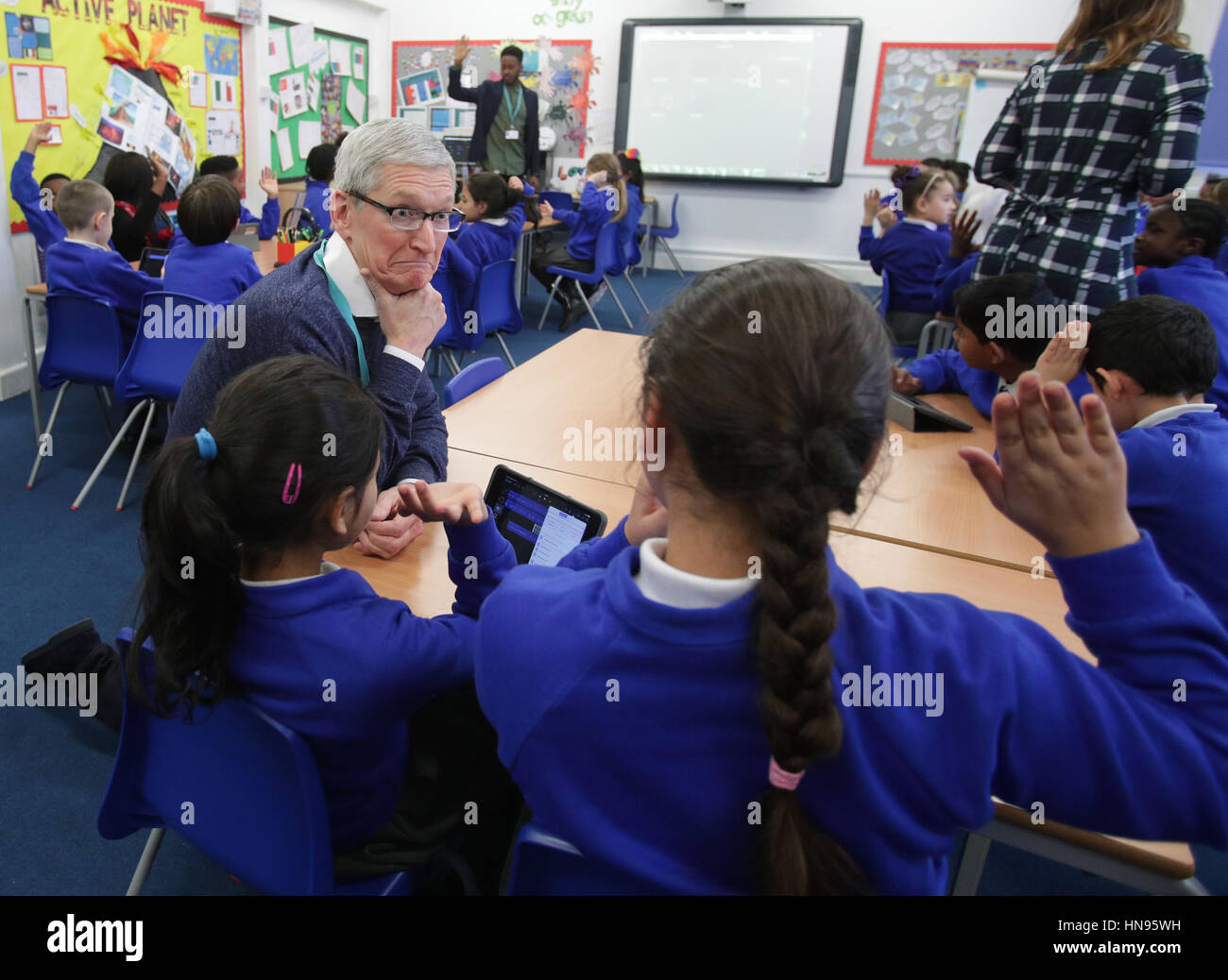 Tim Cook, CEO of Apple, interacts with Year 4 pupils in a classroom ...