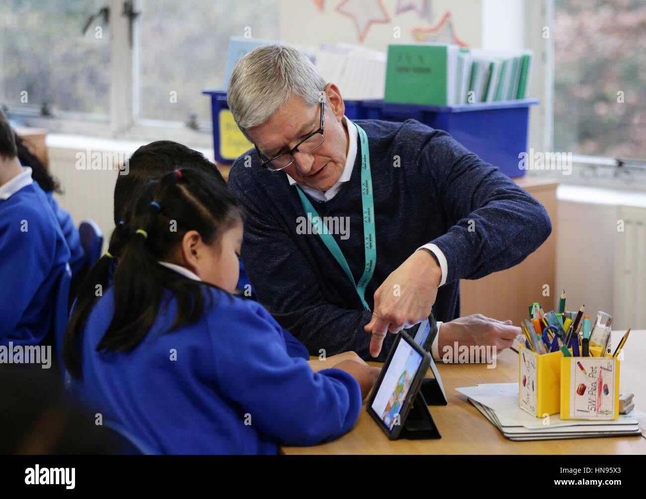 Tim Cook, CEO of Apple, interacts with Year 5 pupils in a classroom ...