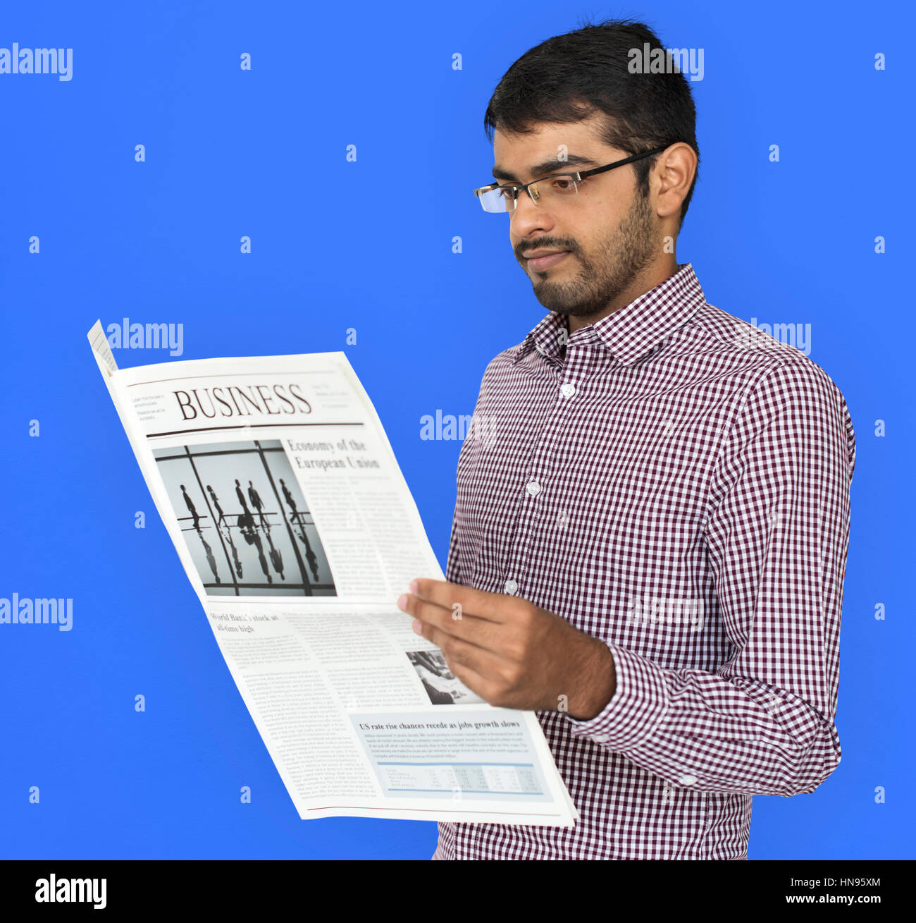 Indian man with newspaper hi-res stock photography and images - Alamy