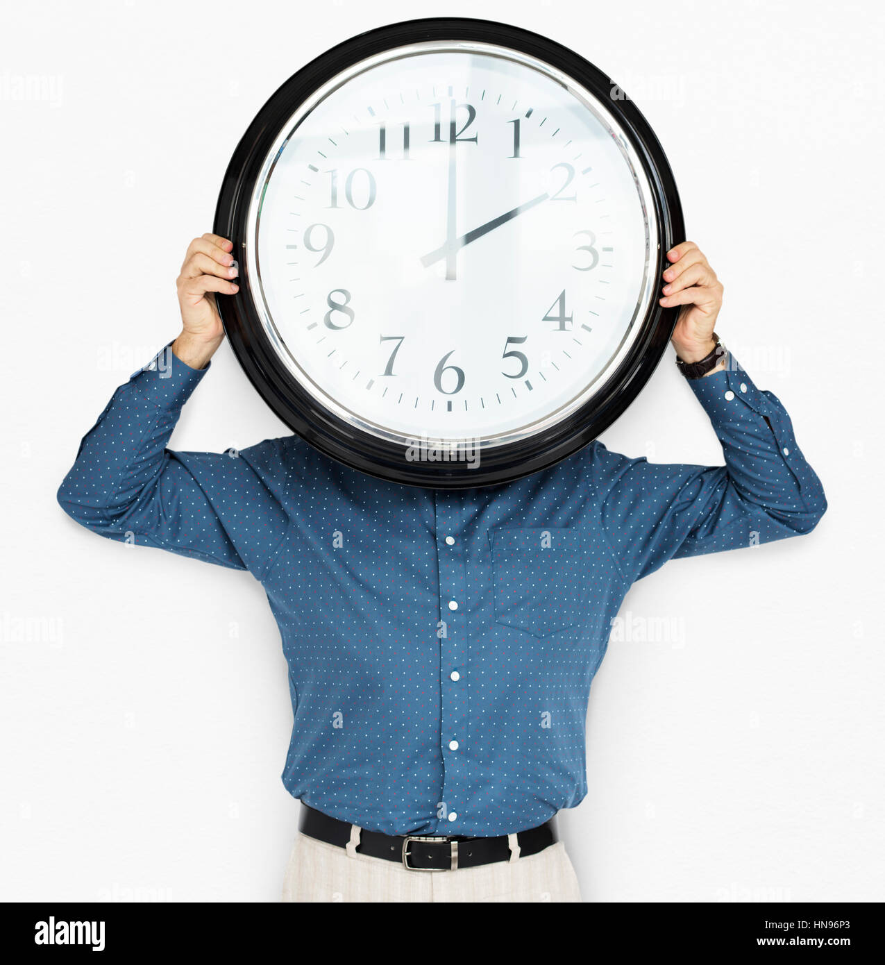 Man Holding Clock Covering Face Stock Photo - Alamy