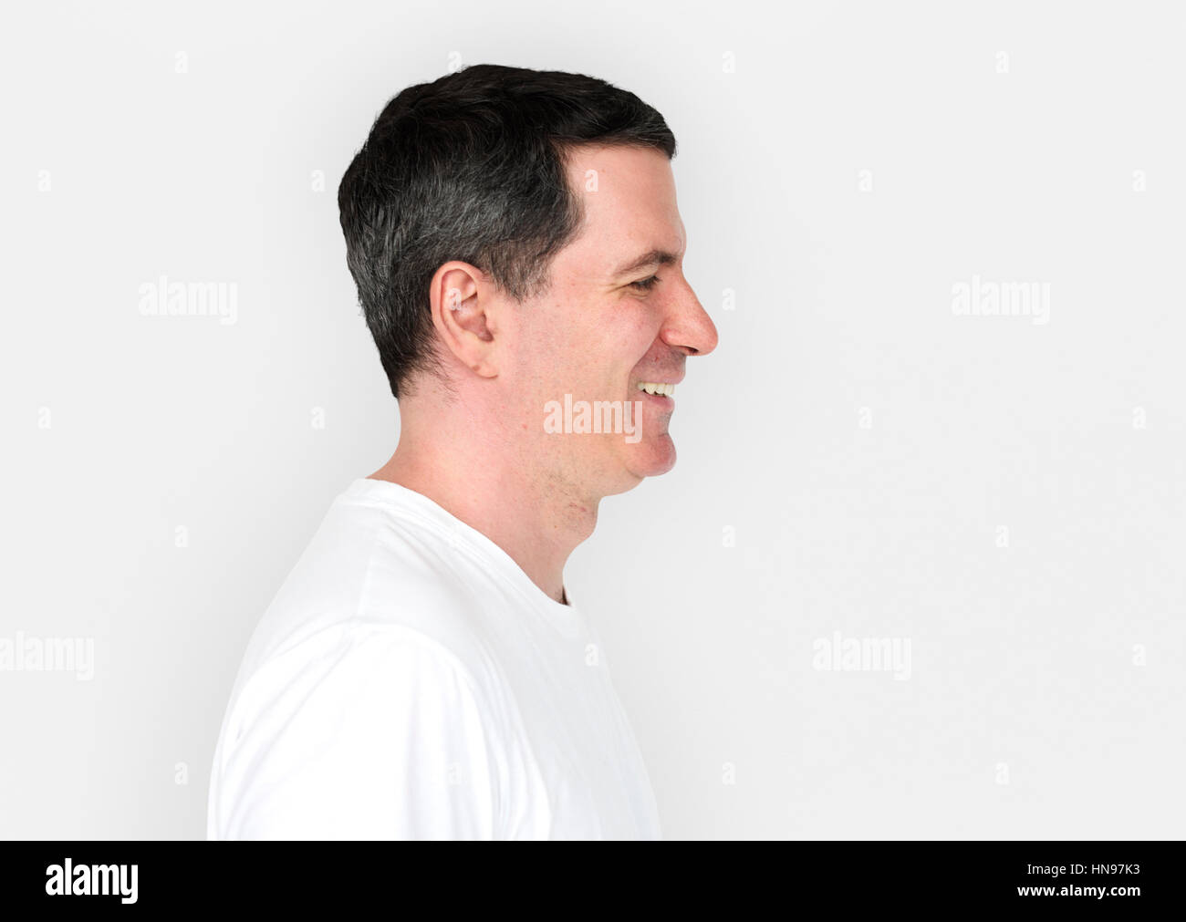 Caucasian Man Smiling Happy Side View Stock Photo - Alamy