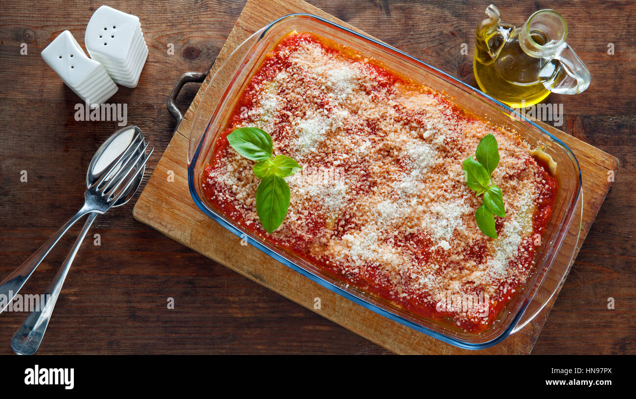 classic Italian lasagna on vintage wooden table Stock Photo - Alamy