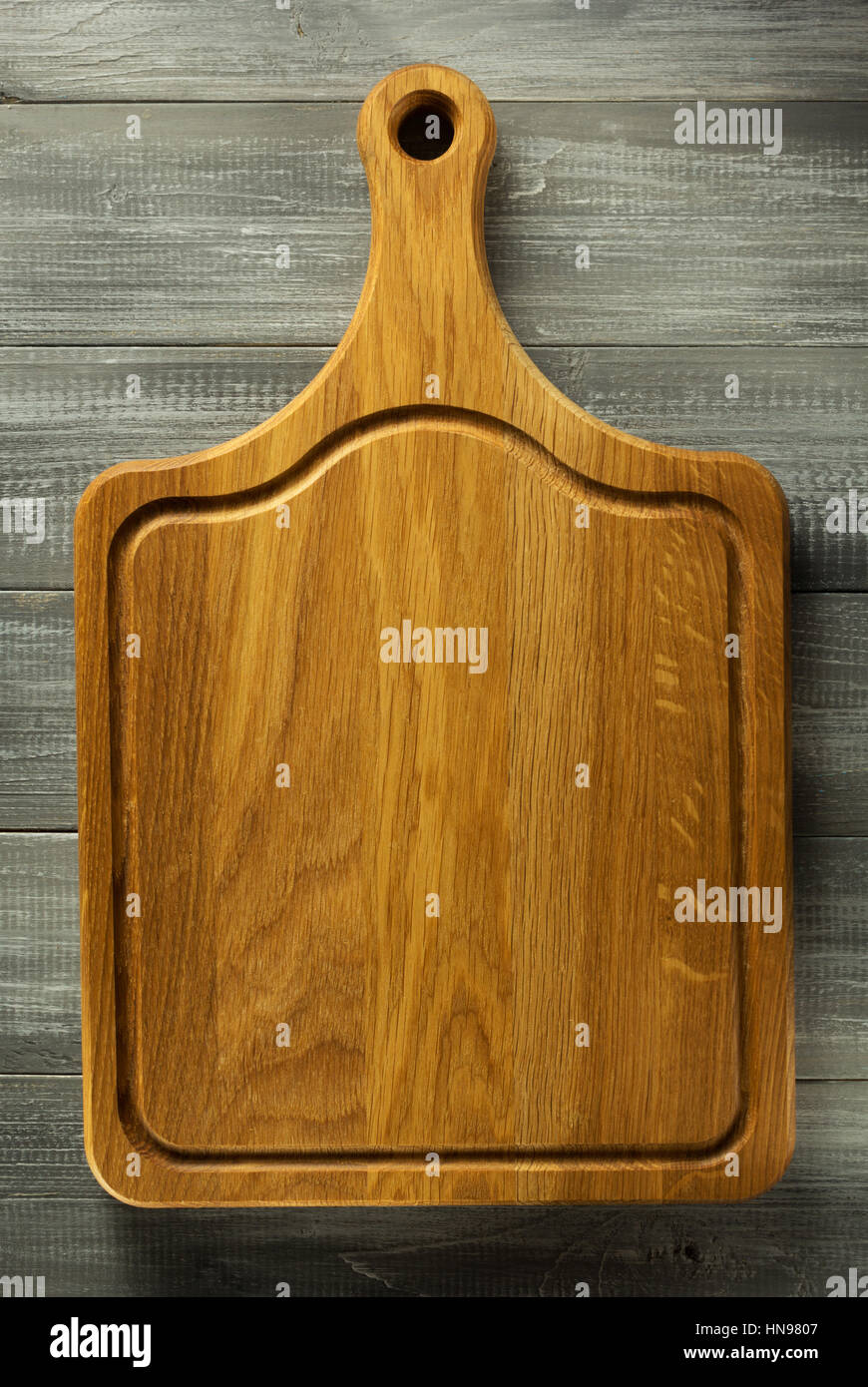 cutting board at wooden table surface Stock Photo - Alamy
