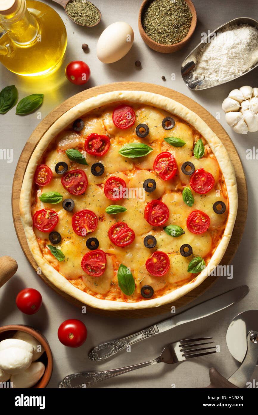 italian pizza at old surface background Stock Photo - Alamy
