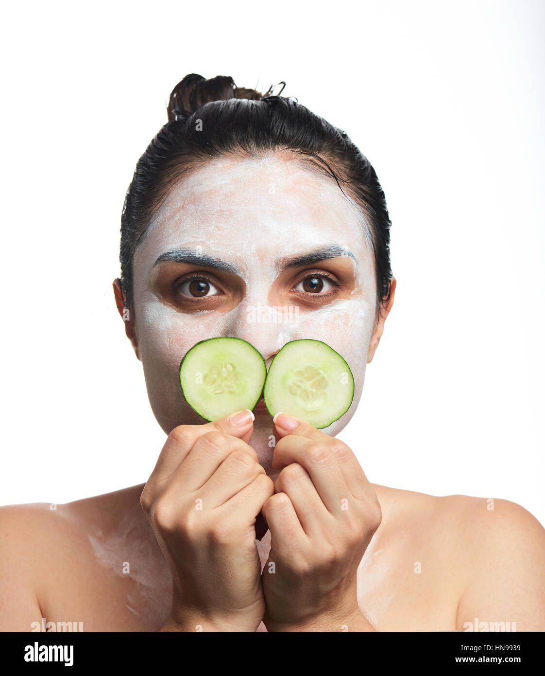 woman slices of cucumber for skin mask isolated on white Stock Photo ...