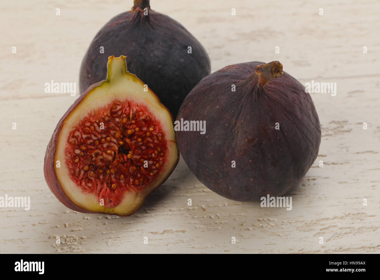Sweet ripe figs over wood bacgroubd Stock Photo - Alamy