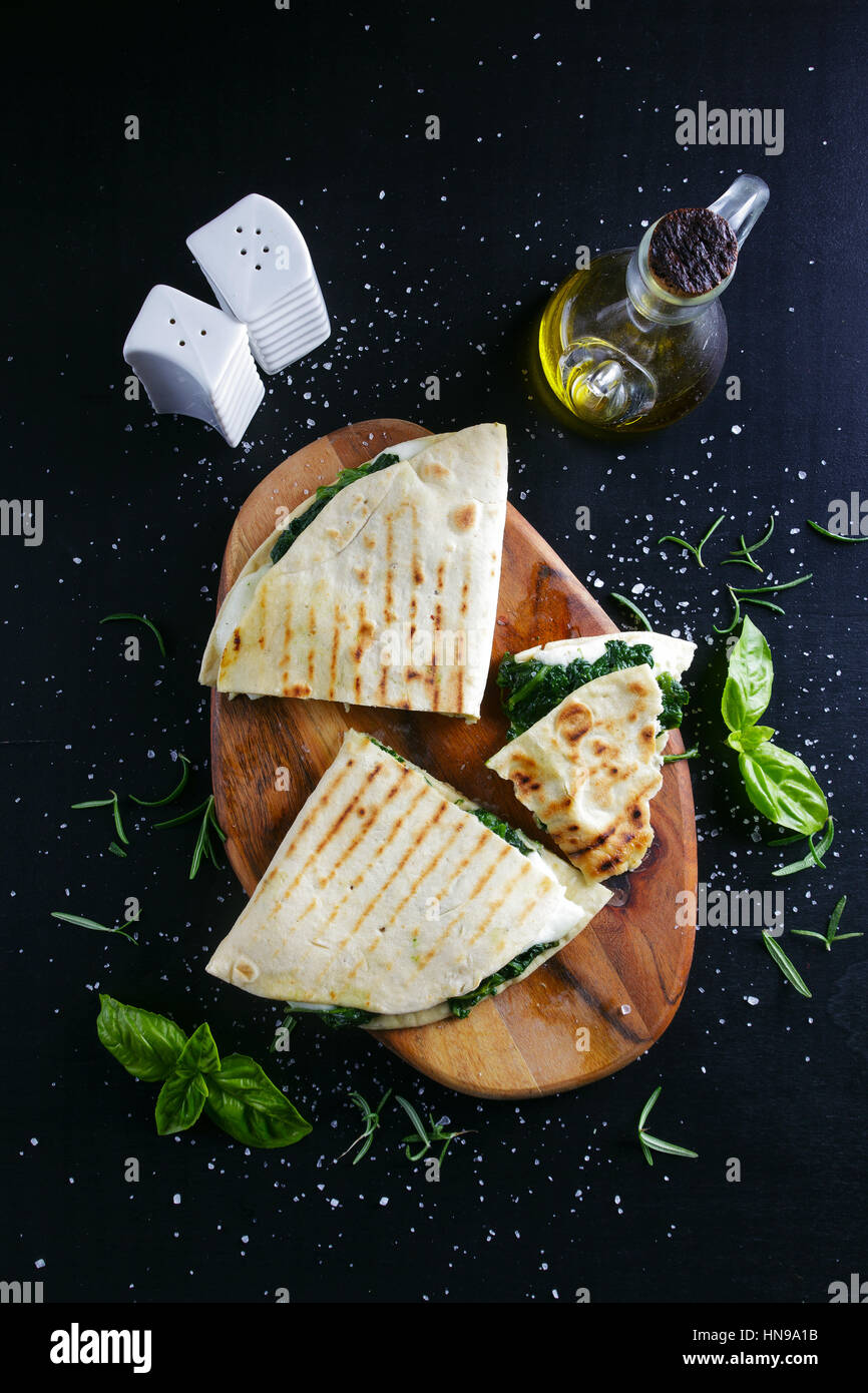 piadina with spinach and mozzarella. Italian healthy snack. street food ...