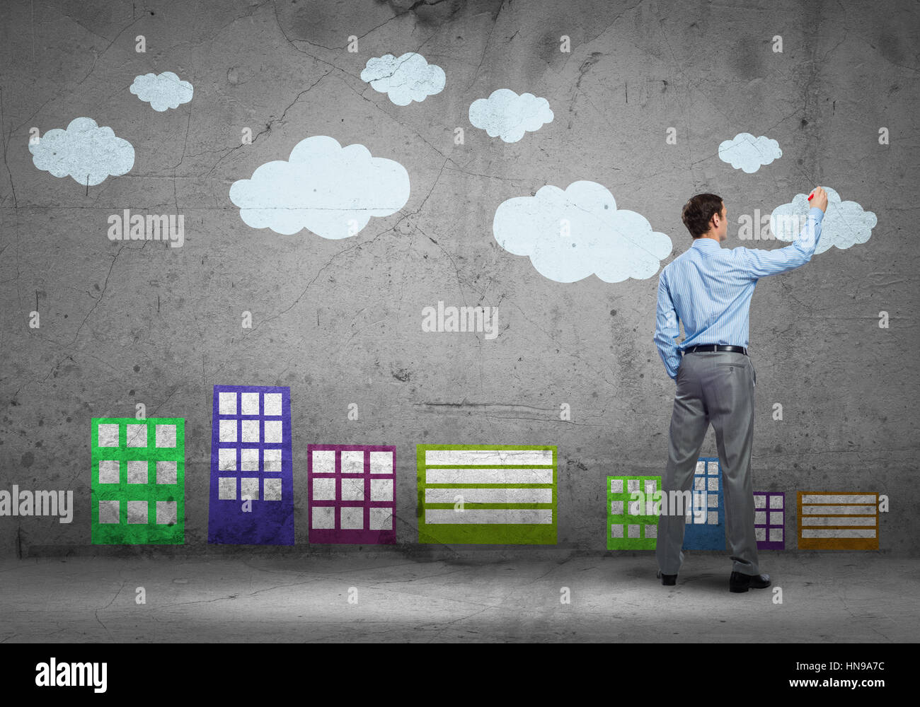 Back view of businessman drawing sketches of construction project on ...