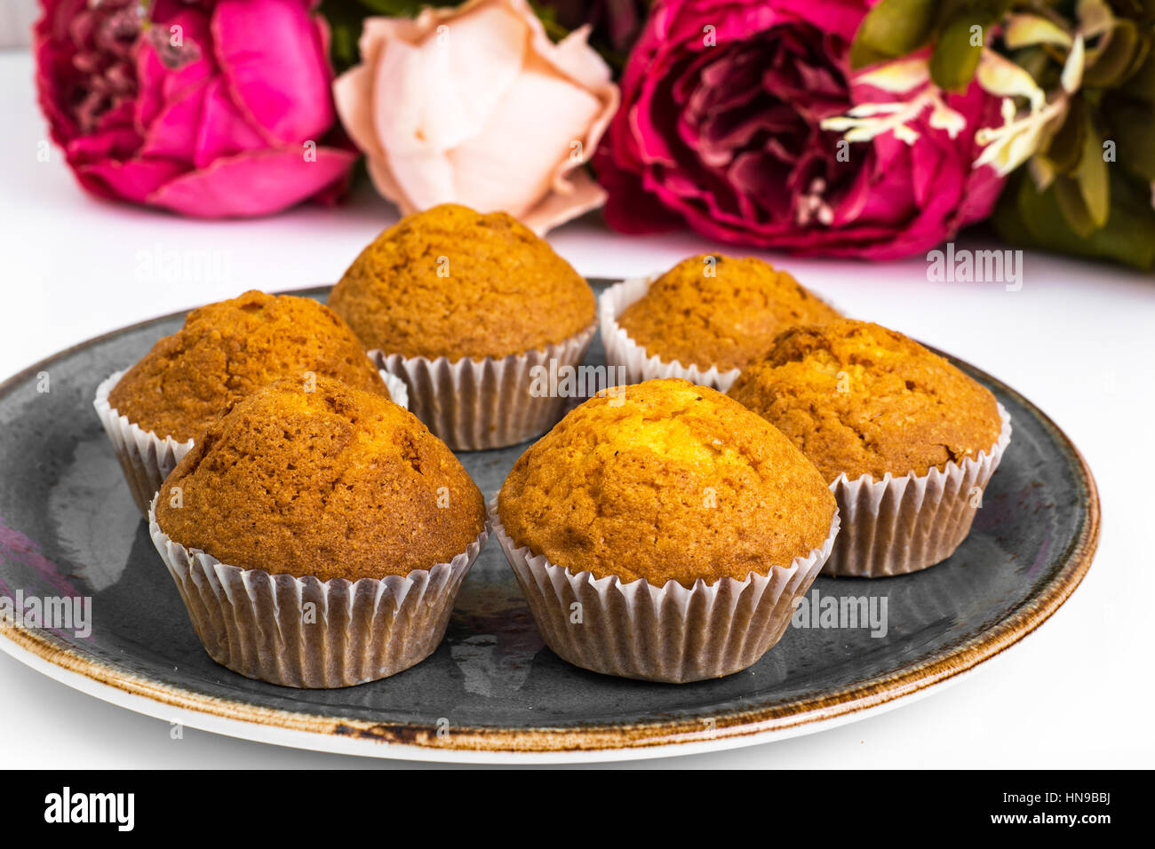 Vanilla mini muffins with chocolate topping Stock Photo - Alamy