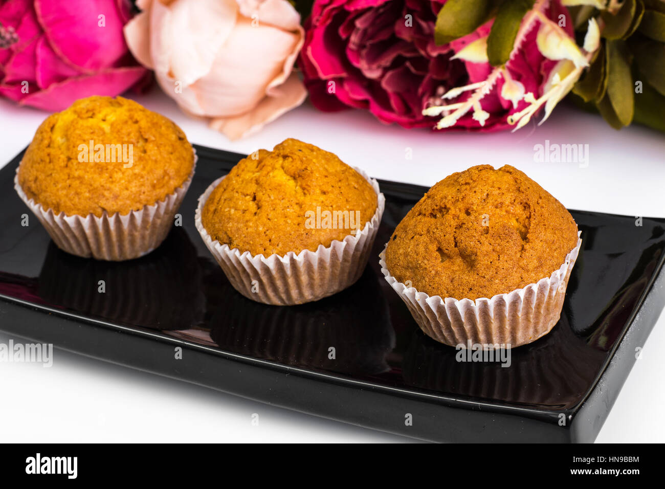 Vanilla mini muffins with chocolate topping Stock Photo - Alamy