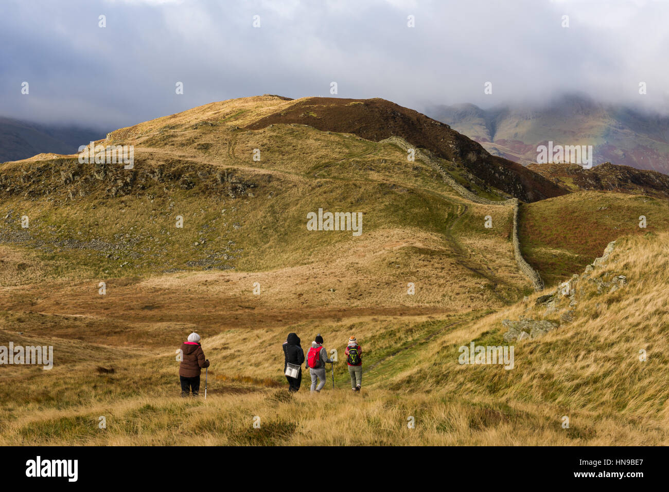 Fell walkers on Lingmoor Fell in the Lake District National Park ...