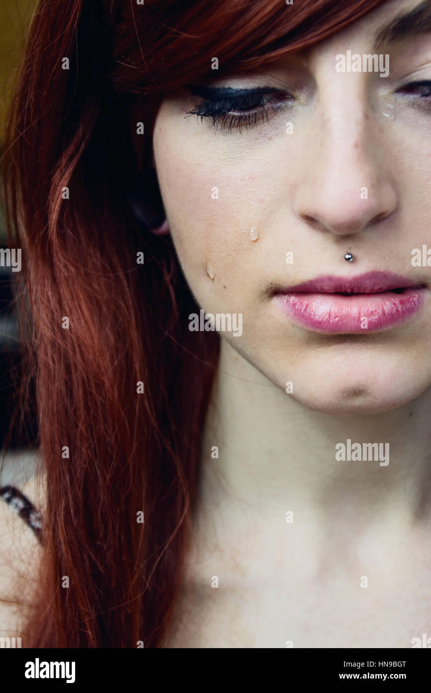 Young redhead woman crying Stock Photo - Alamy