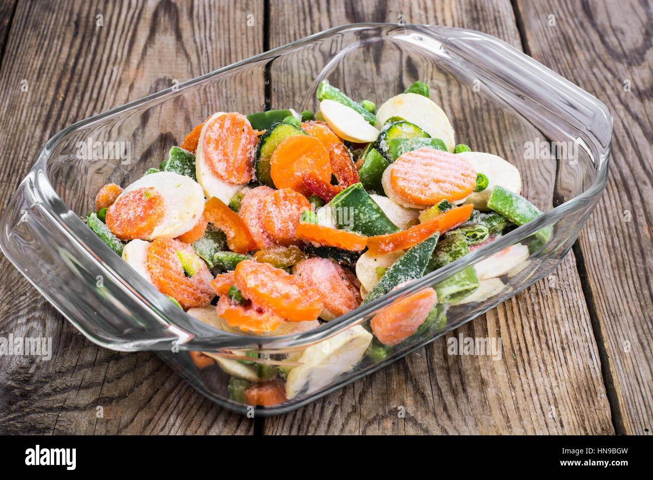 Mix of deep-frozen vegetables in glass form Stock Photo - Alamy