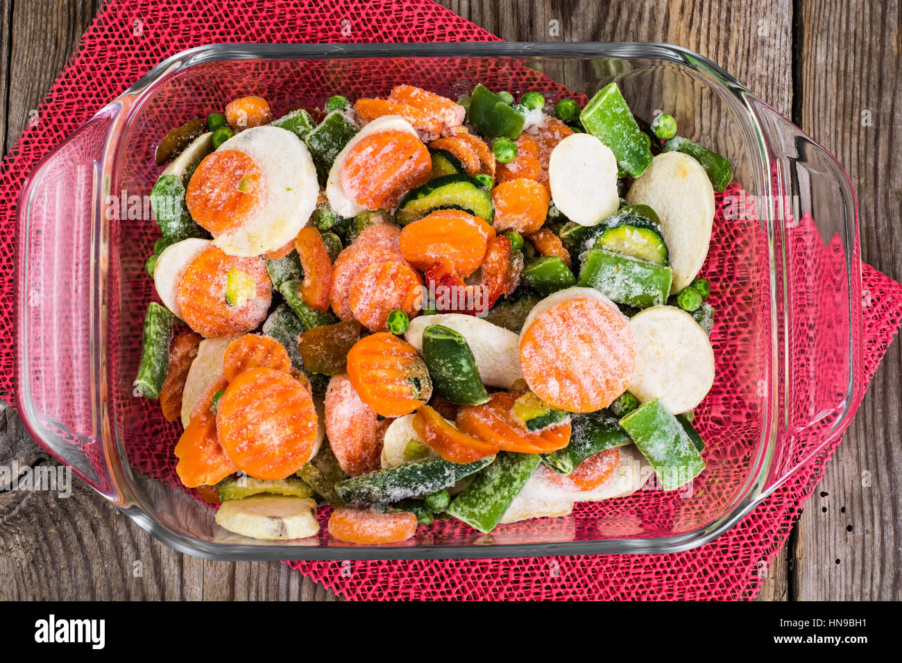 Mix of deep-frozen vegetables in glass form Stock Photo - Alamy