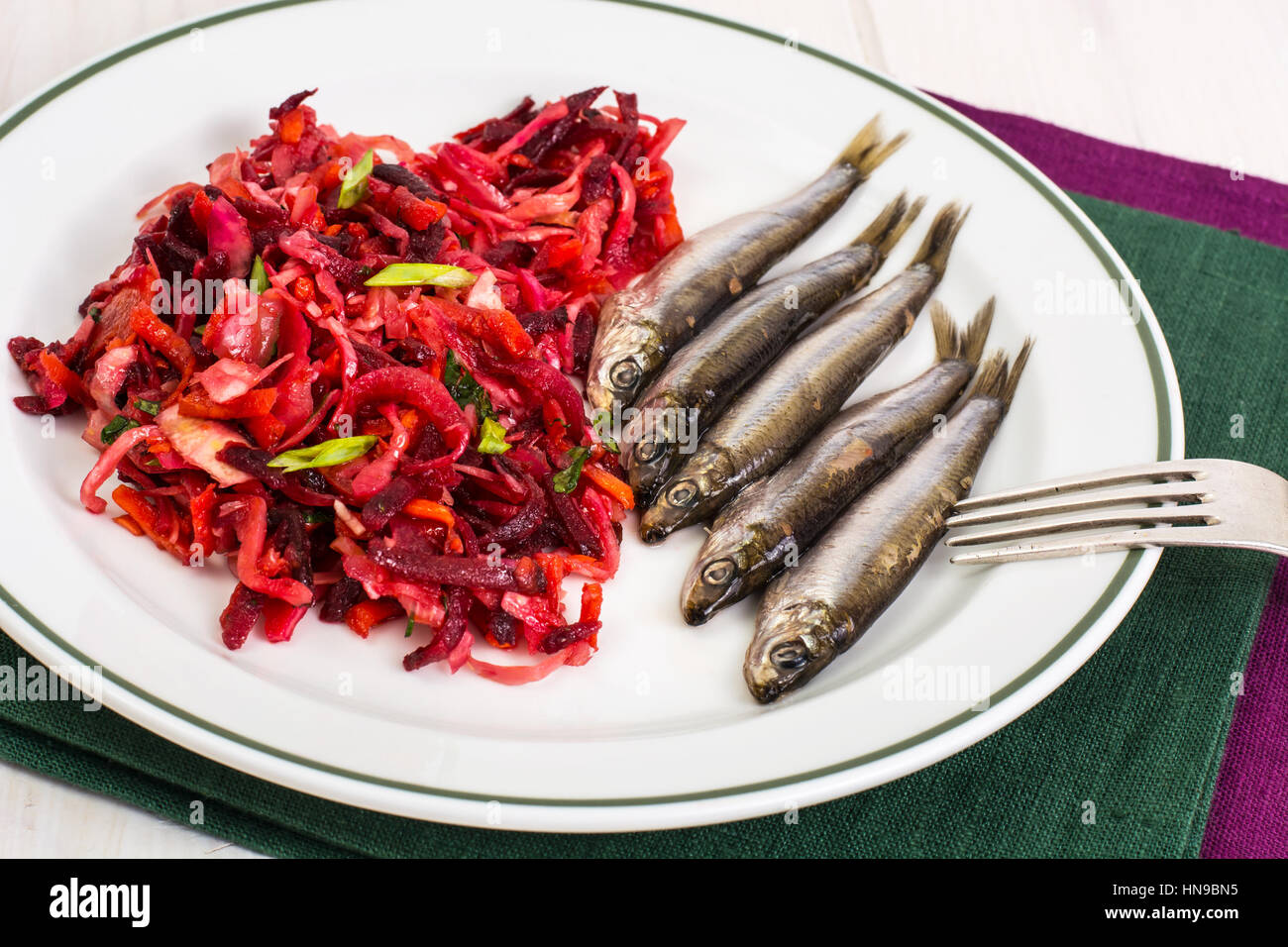 Sprats and vegetable salad Stock Photo - Alamy