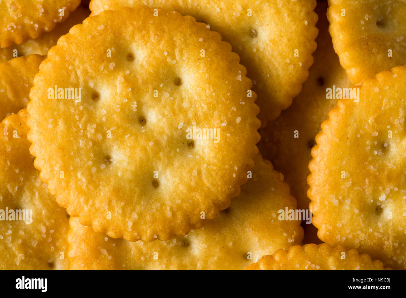 Round Salty Yellow Crackers Ready to Eat Stock Photo - Alamy